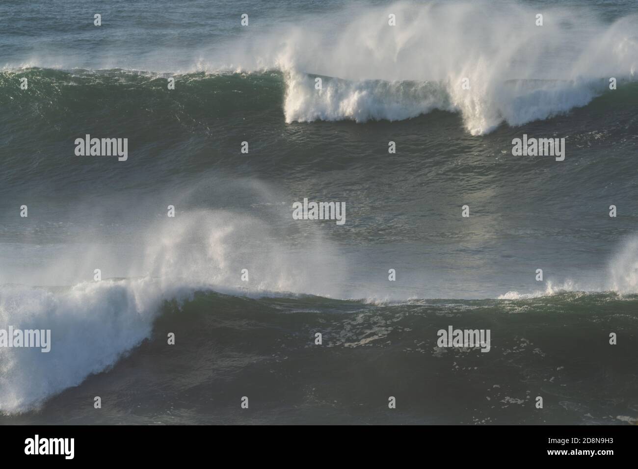 Detail view of large waves breaking in the open ocean during a tropical ...