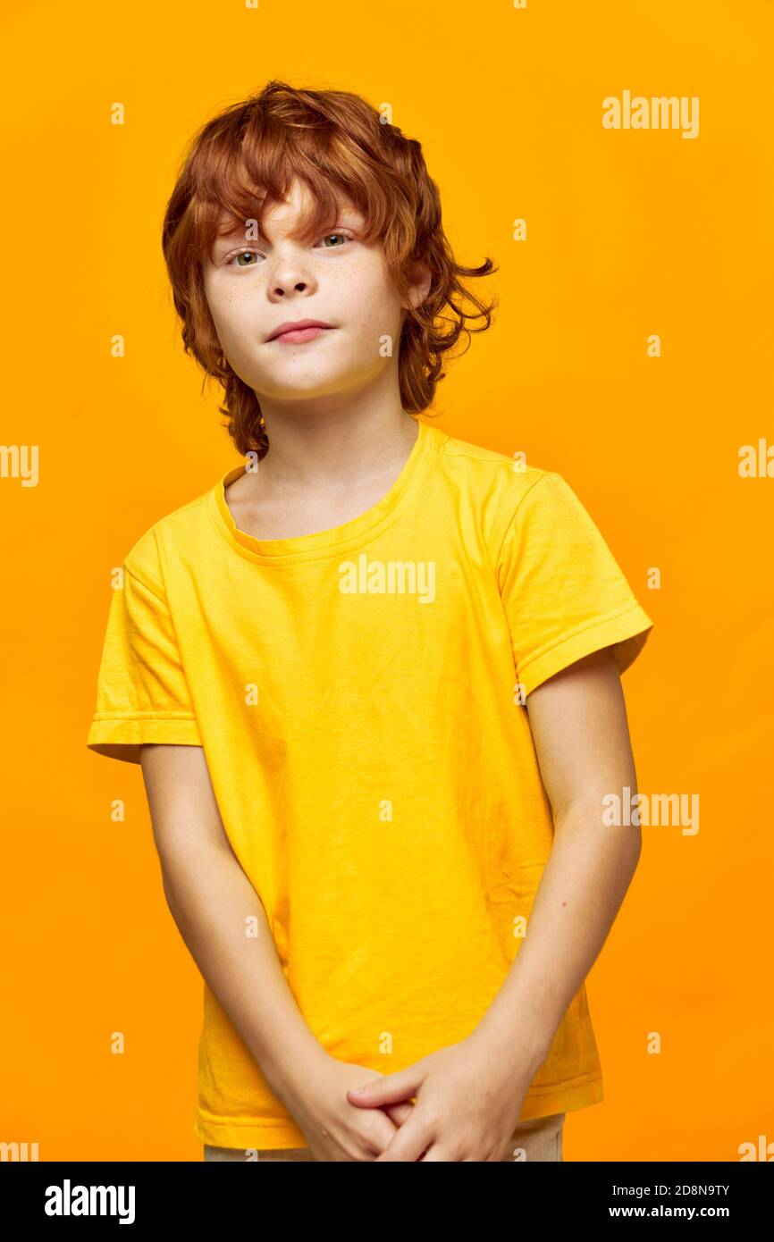 The child with red hair on an isolated background Stock Photo - Alamy