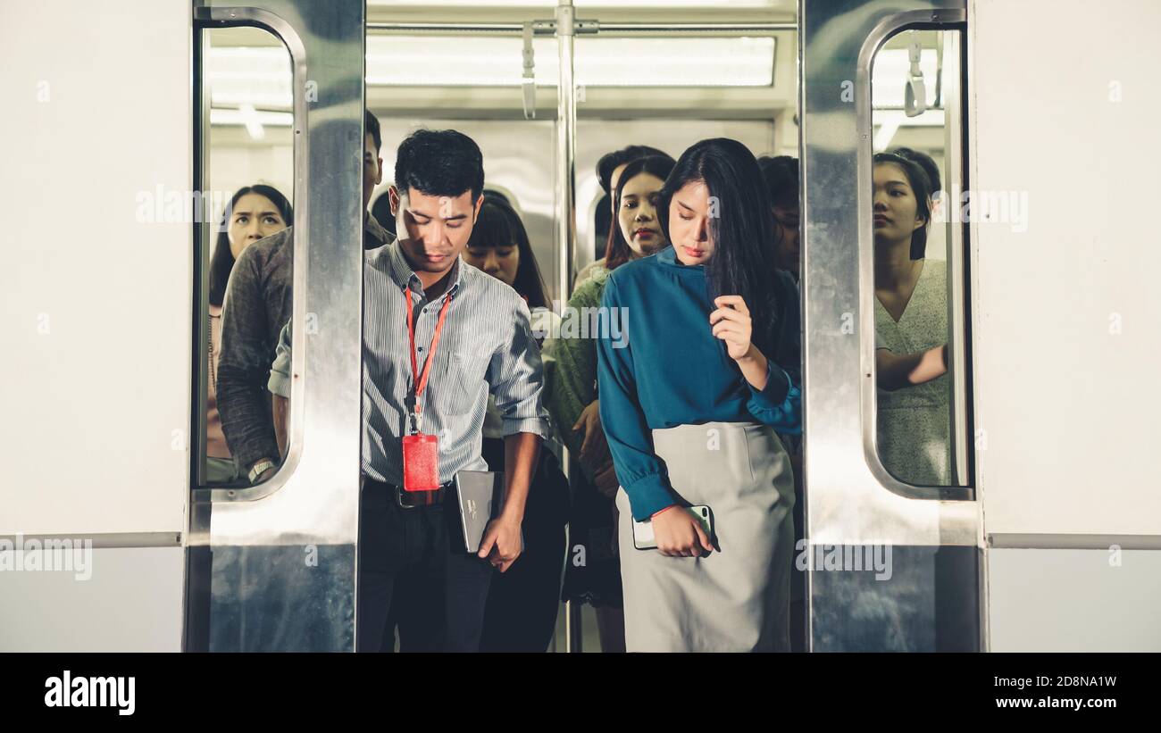 Many people crowded into a full subway hi-res stock photography and ...