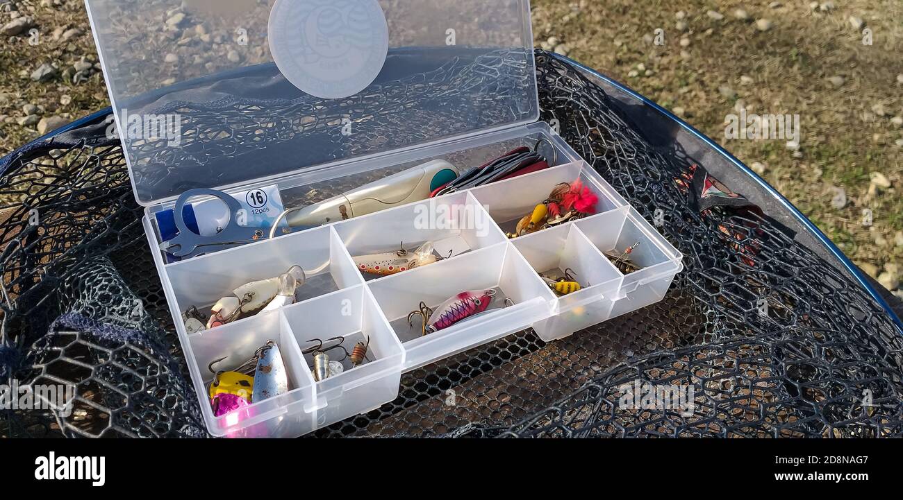 Trout fishing equipment in the lake with the spinning technique Stock ...