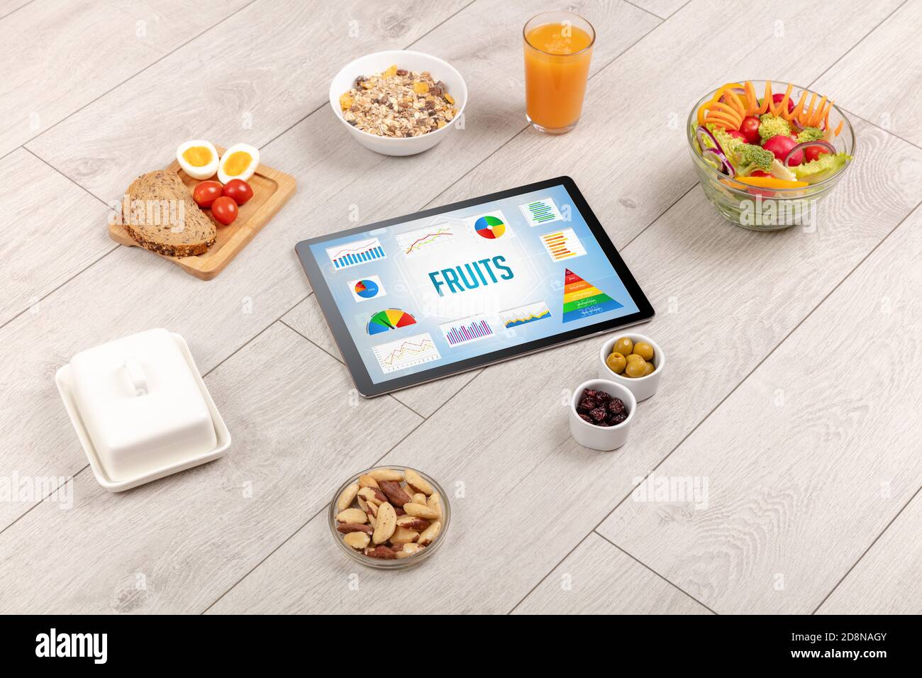 Organic food and tablet pc showing FRUITS inscription, healthy ...