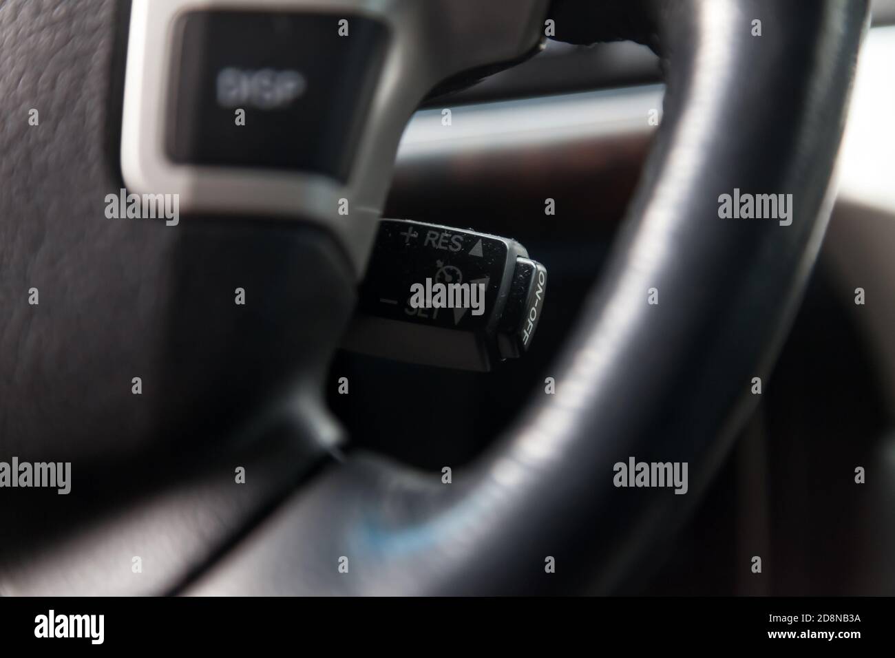 The shift lever to set the automatic cruise control speed inside the ...