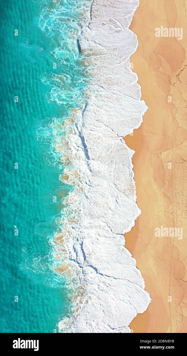 Sand and ocean waves Stock Photo - Alamy