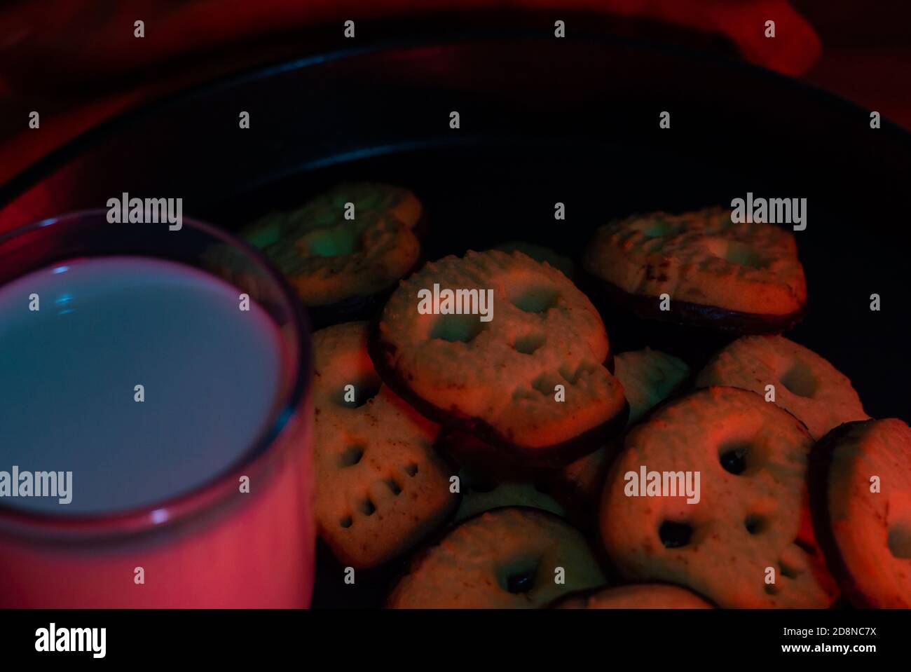 Halloween skill cookies with milk Stock Photo - Alamy