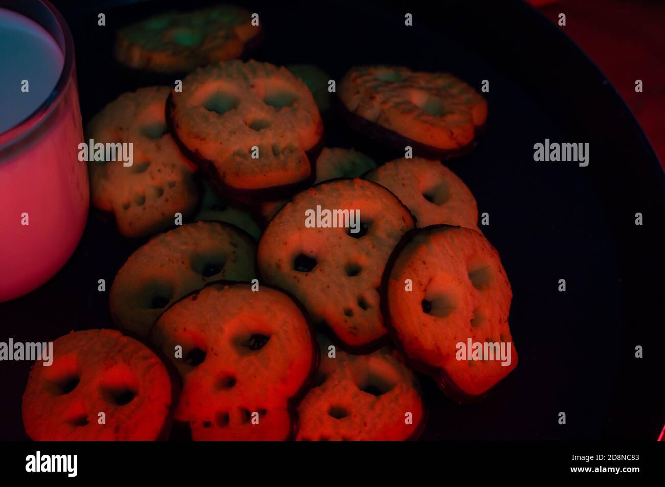 Halloween skill cookies with milk Stock Photo - Alamy