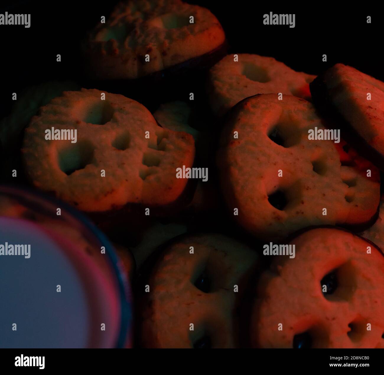 Halloween skill cookies with milk Stock Photo - Alamy