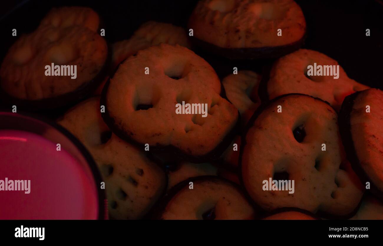 Halloween skill cookies with milk Stock Photo - Alamy