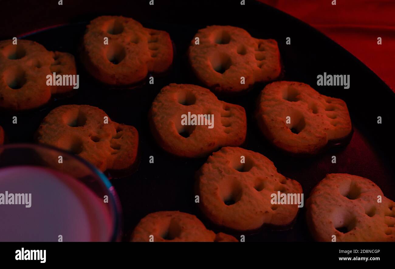 Halloween skill cookies with milk Stock Photo - Alamy