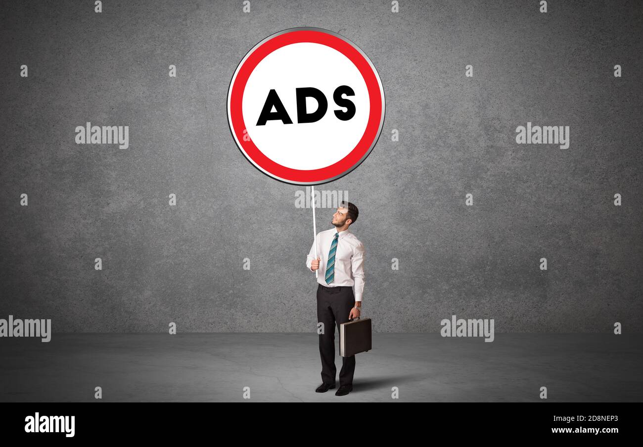Young business person holdig traffic sign with ADS abbreviation ...