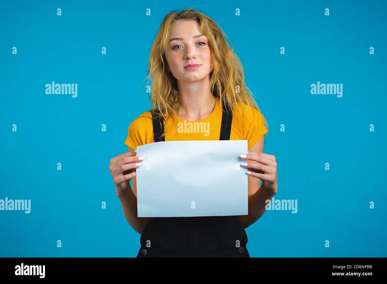 Person holding a4 paper hi-res stock photography and images - Alamy