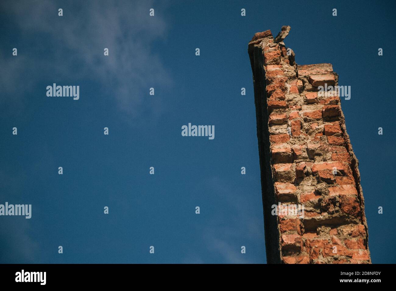 Low angle shot of a tall destroyed building with barbed wires Stock ...