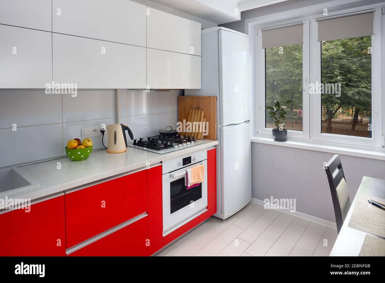 Upscale Maple Red and Smoky White kitchen in luxury home with stoneware ...