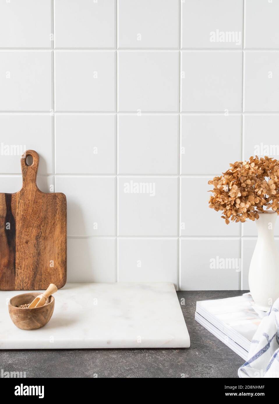 Stylish white kitchen background with brown kitchen utensils and decor ...