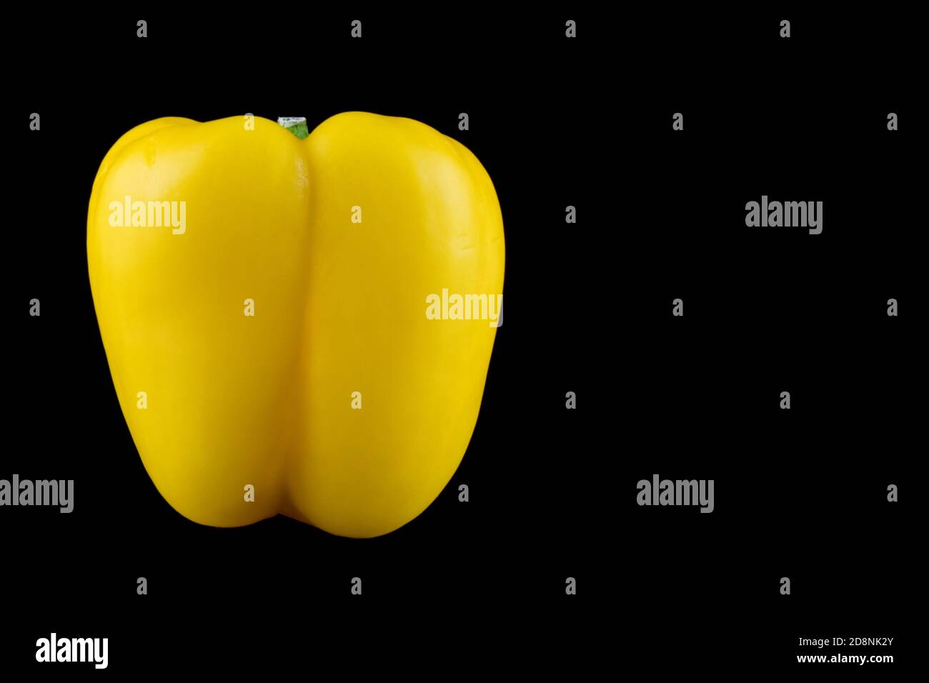 Fresh yellow capsicum isolated against a black background Stock Photo ...