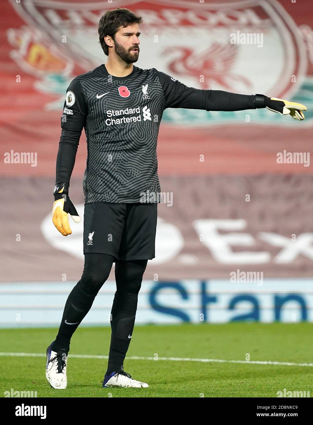 Liverpool goalkeeper Alisson instructs his players during the Premier ...