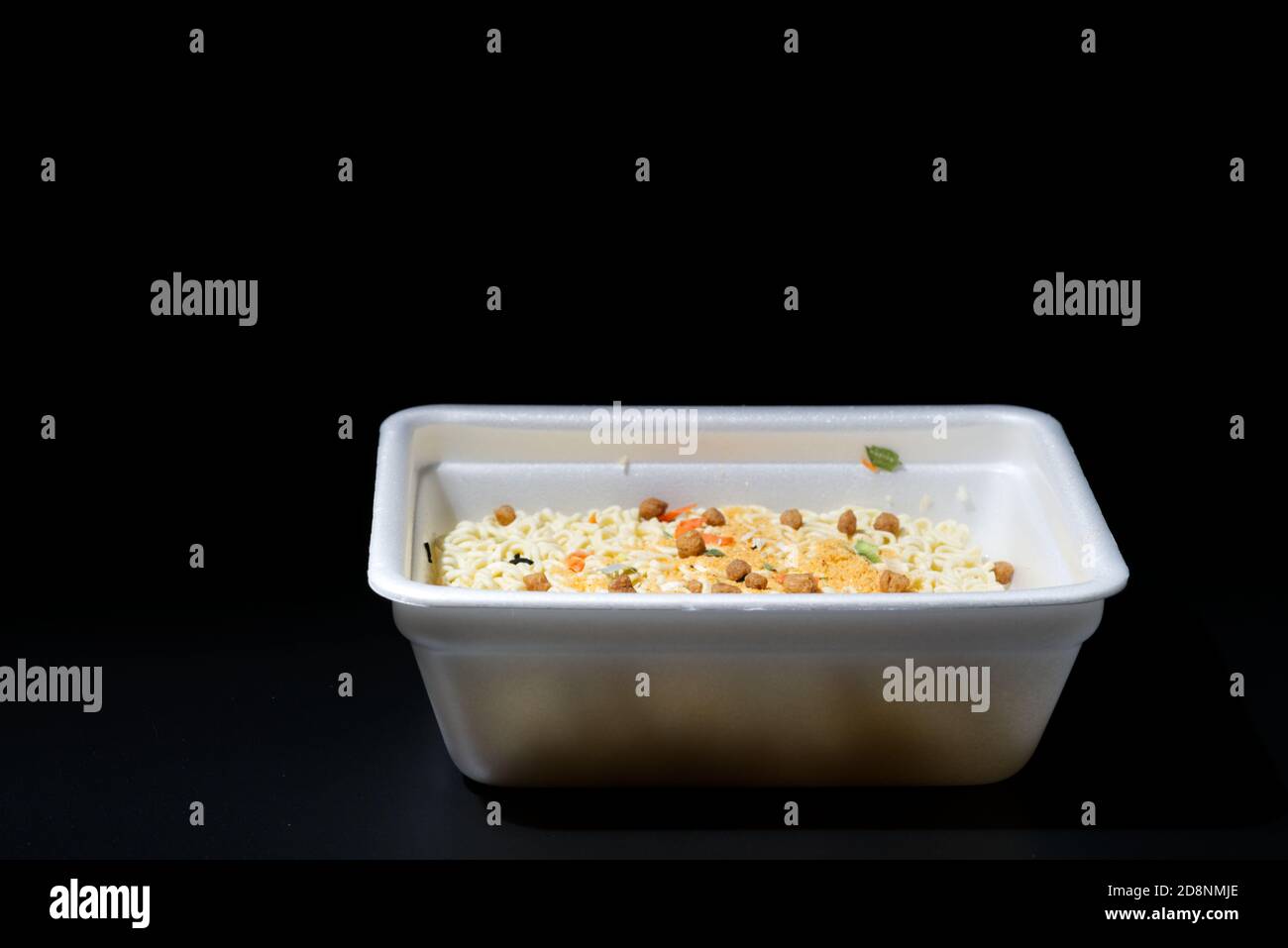 Dry instant noodles in rectangle plastic plate, top view Stock Photo ...