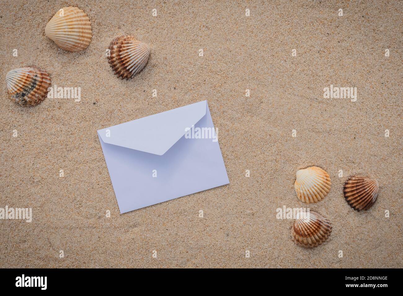 Background grains of sea sand, fine beach sand with envelope and pebble ...