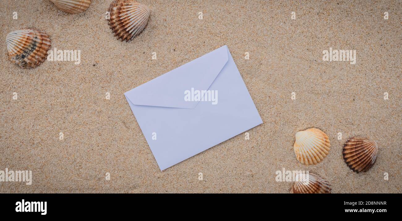 Background grains of sea sand, fine beach sand with envelope and pebble ...