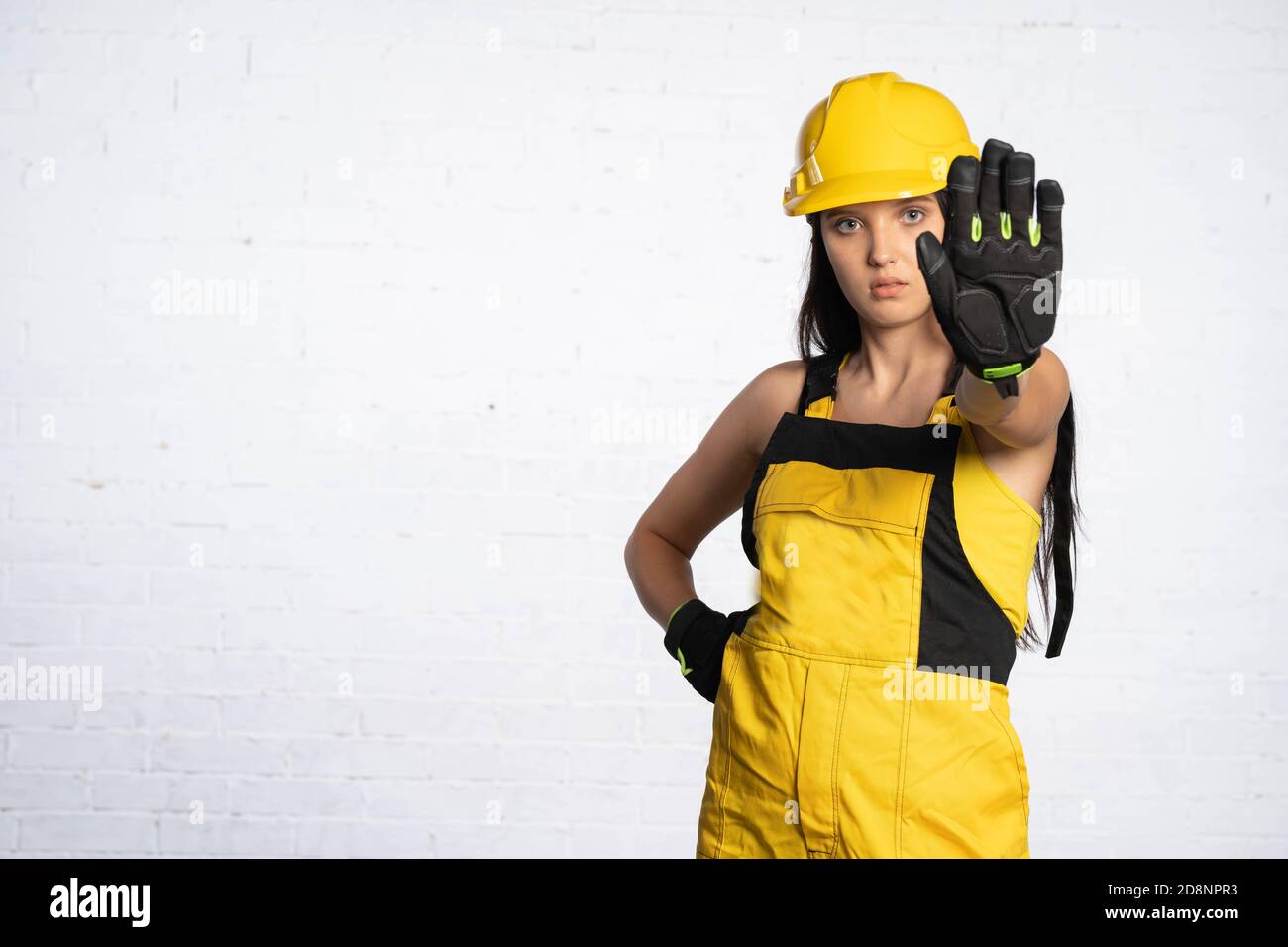 A gloved hand stretched out in front of you in a firm prohibition or ...