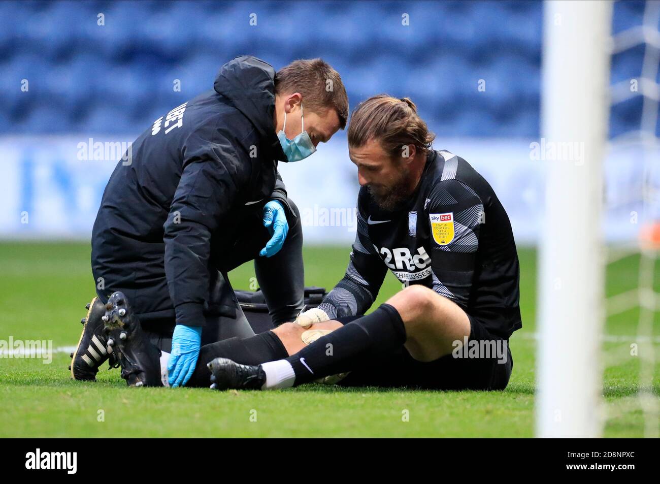 Declan Rudd (1) of Preston North End receives treatment Stock Photo - Alamy