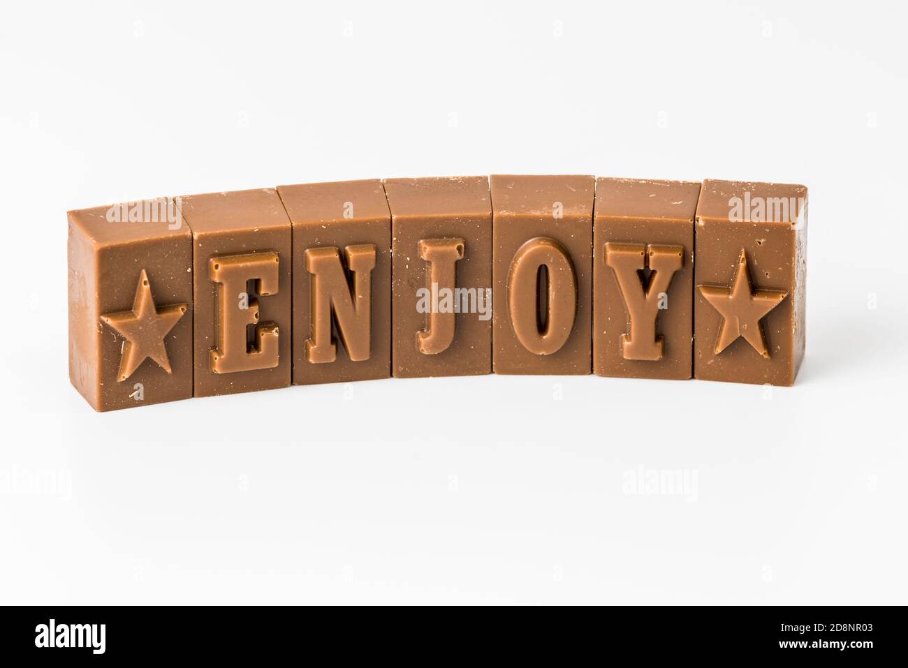 ENJOY lettering with chocolate bars on a white background Stock Photo ...