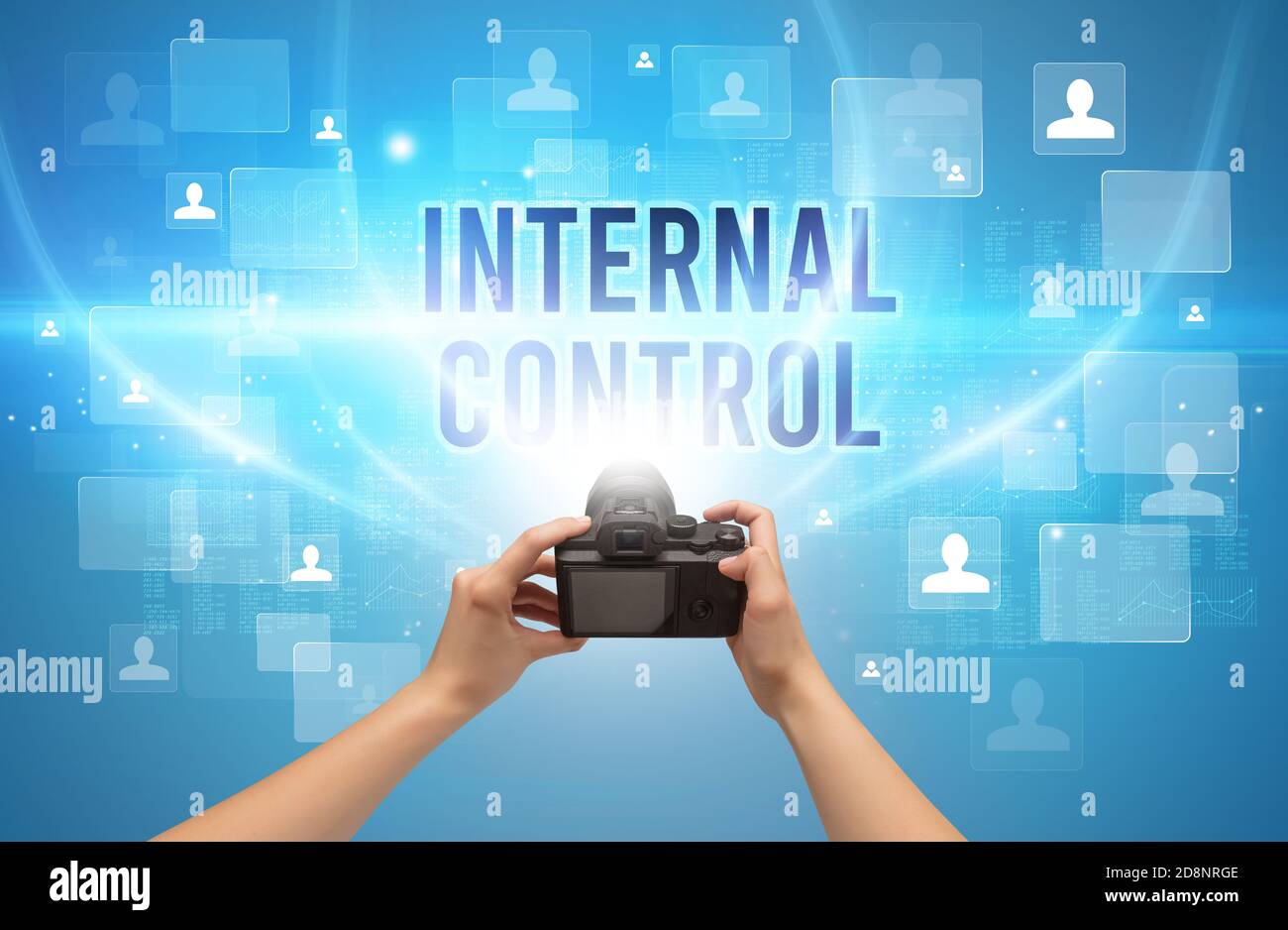 Close-up of hand holding camera with INTERNAL CONTROL inscription ...