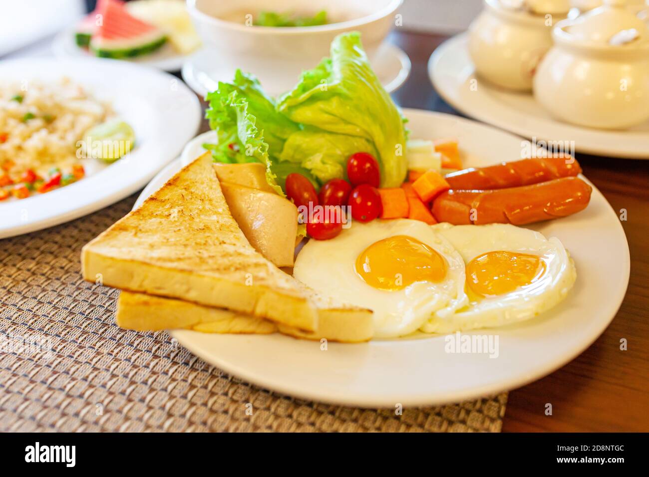 Full American Breakfast on dark, top view, banner. Sunny side fried ...