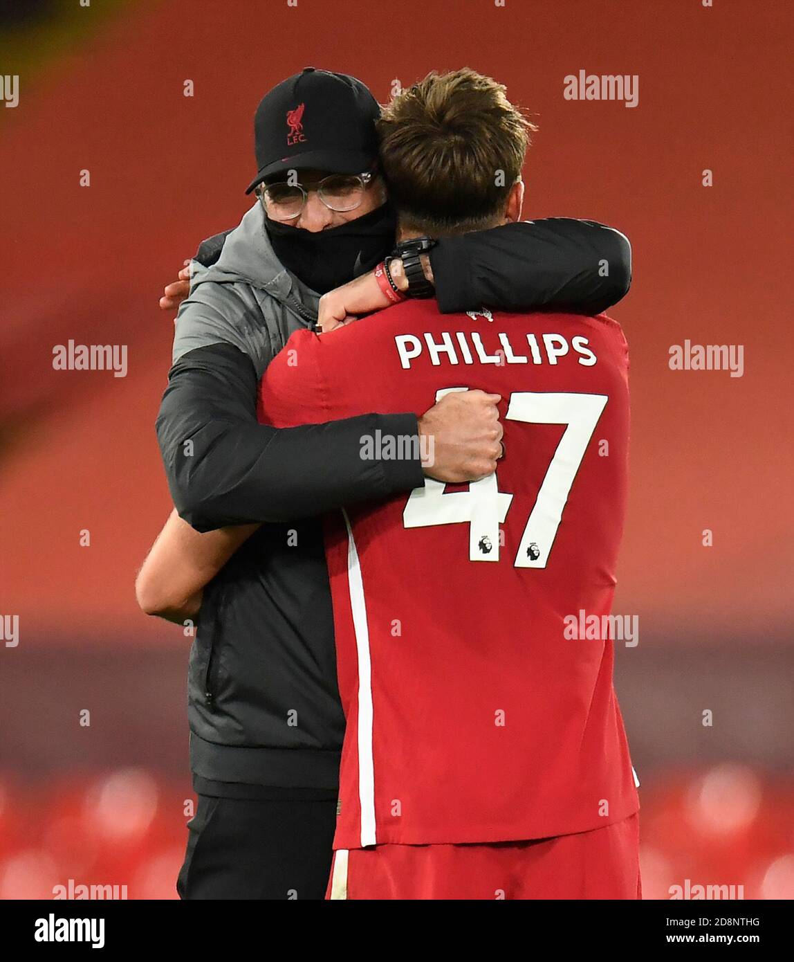 Liverpool manager Jurgen Klopp embraces Nathaniel Phillips after the ...