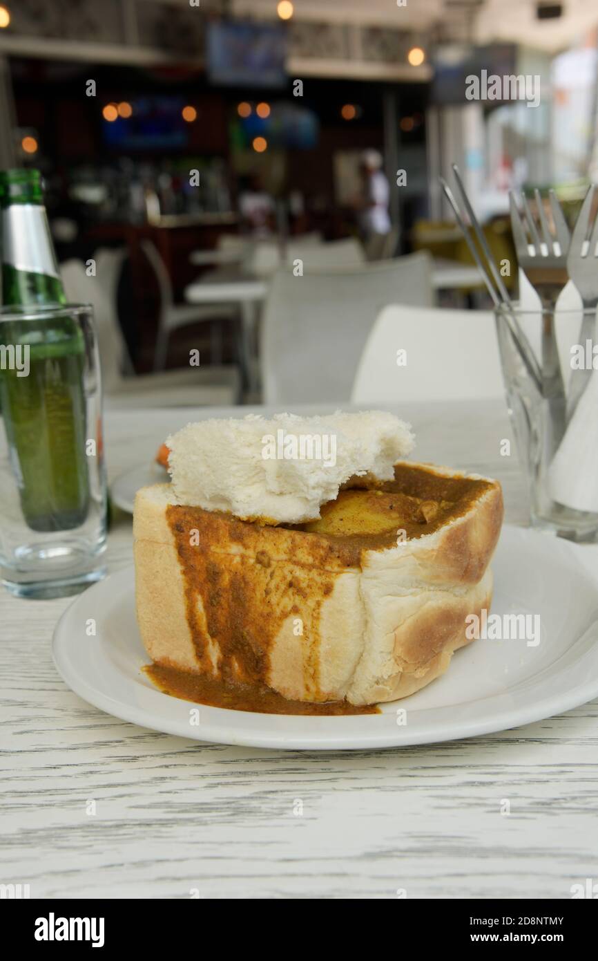 Street food, Bunny Chow, signature dish of Durban, South Africa ...