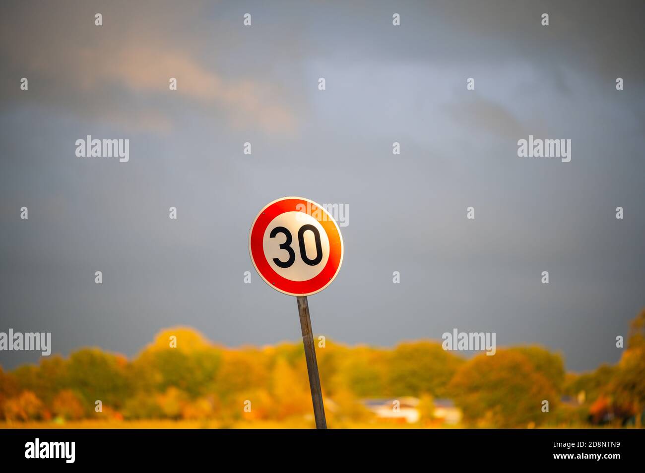 a thirties zone sign with dark ominous clouds in the background Stock ...