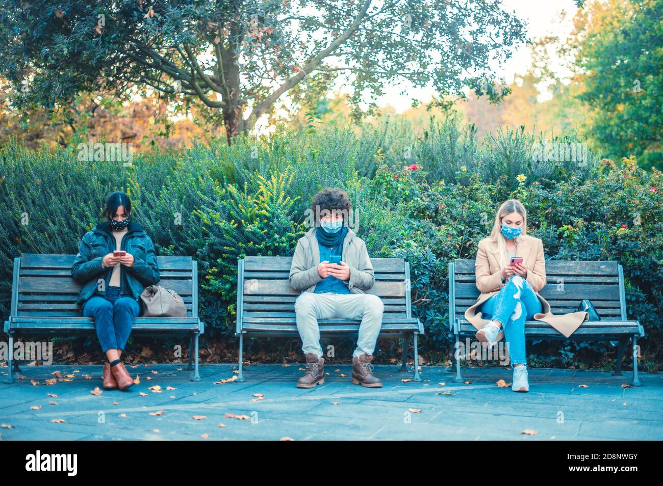 Group of multiracial friends with face mask in social distancing ...