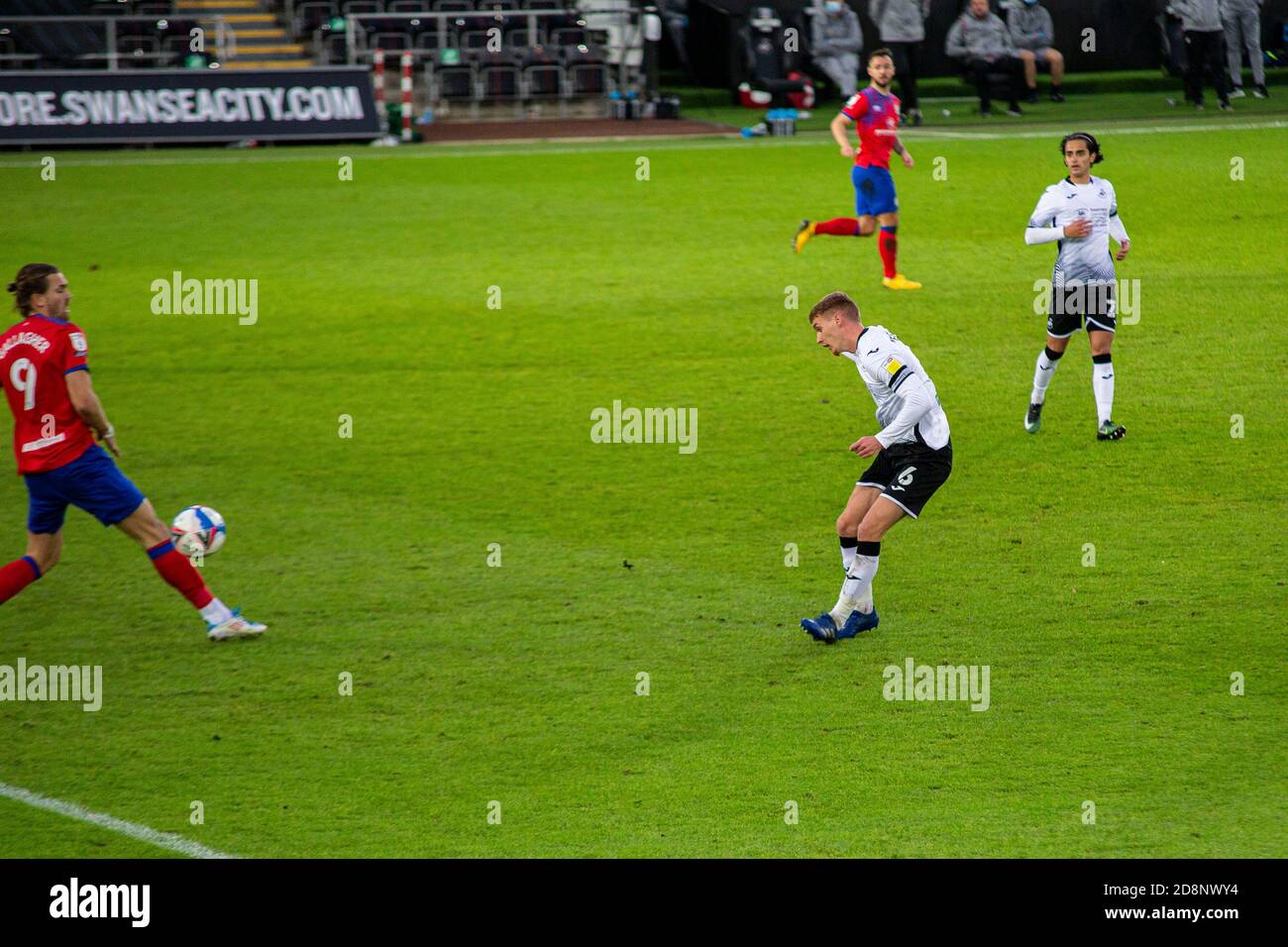 Swansea, UK. 31st Oct, 2020. Jay Fulton of Swansea City with a shot on ...