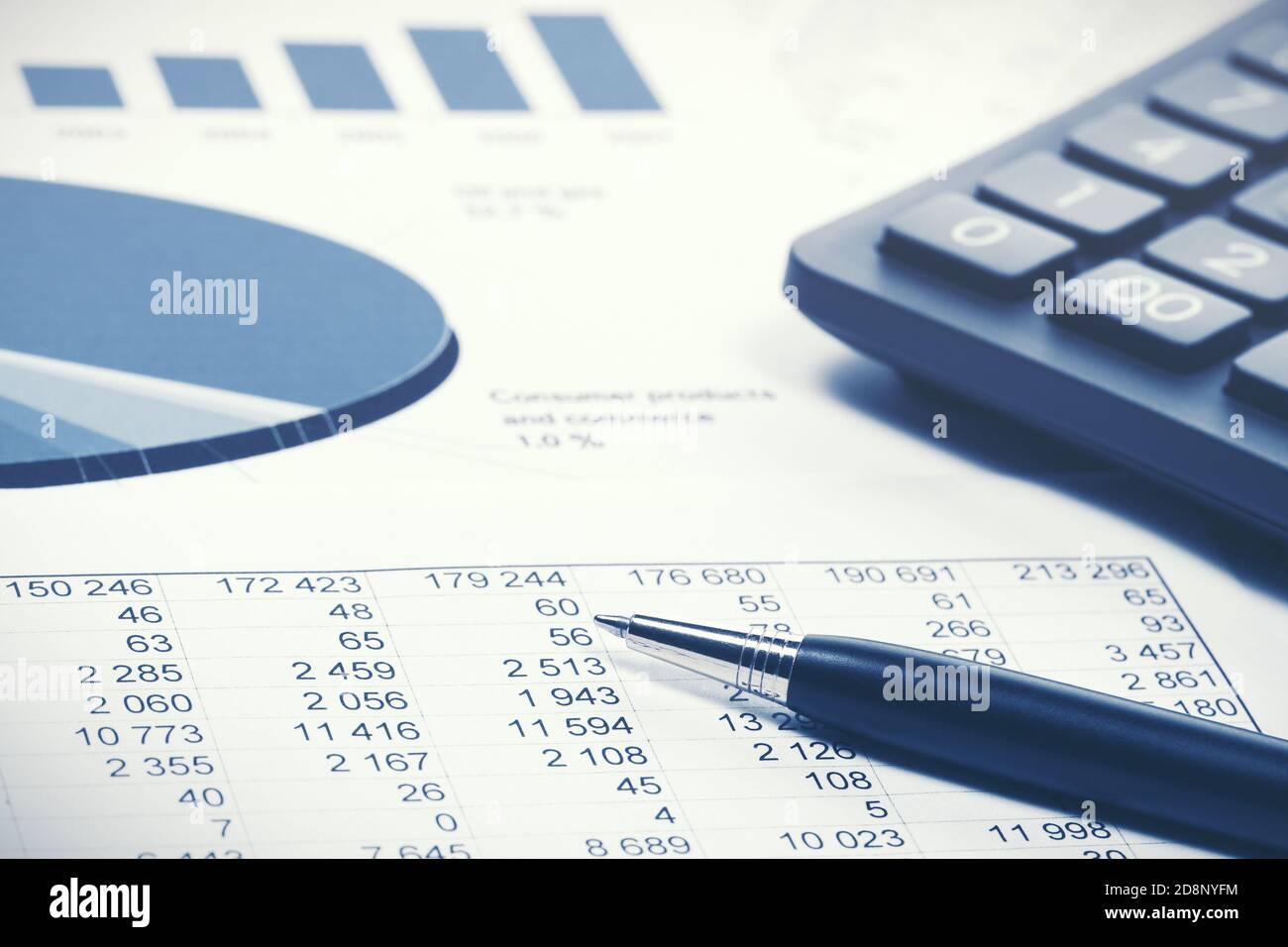 Financial accounting stock market graphs and charts. Pen and calculator ...
