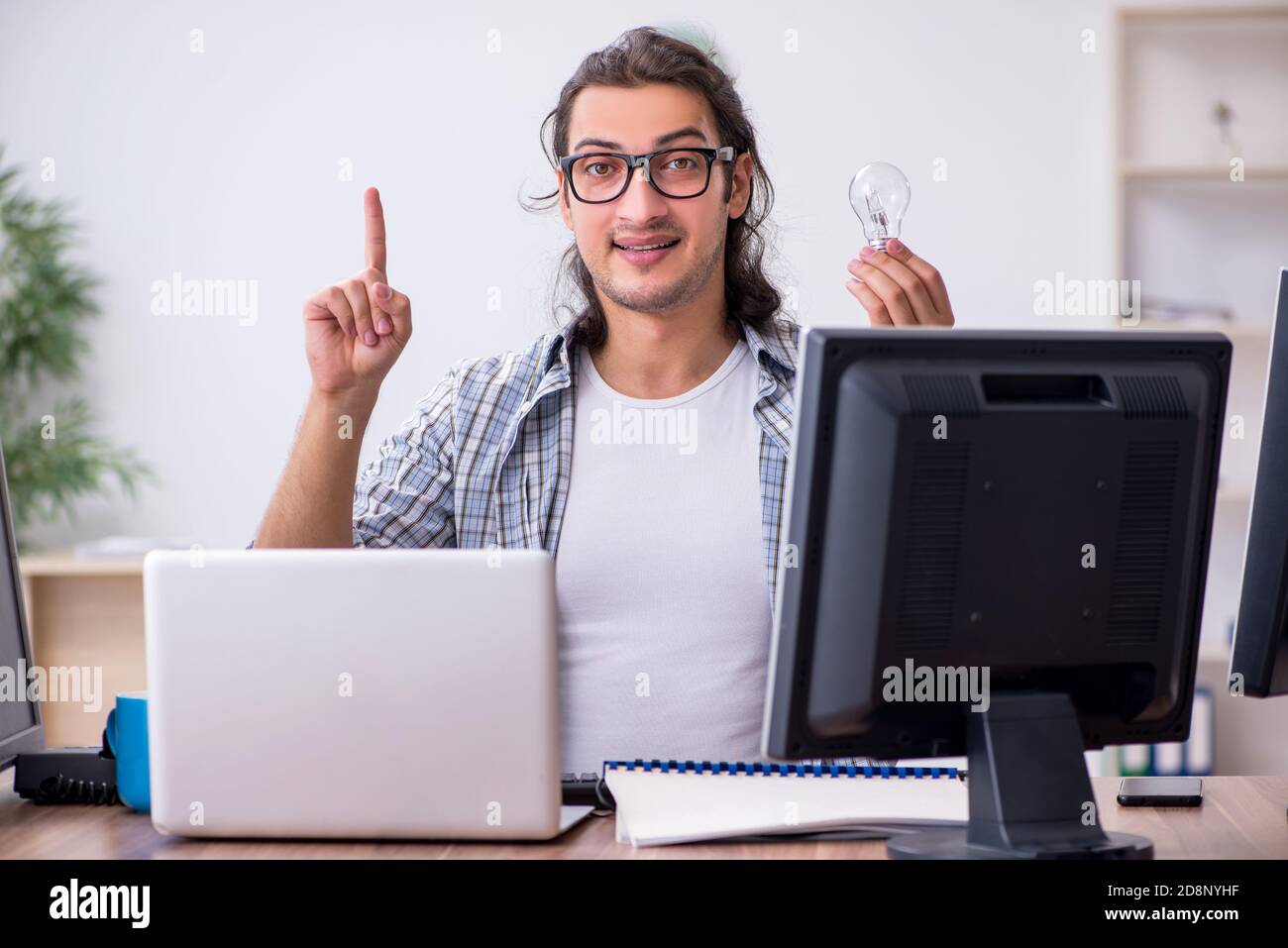Male it specialist working in the office Stock Photo - Alamy