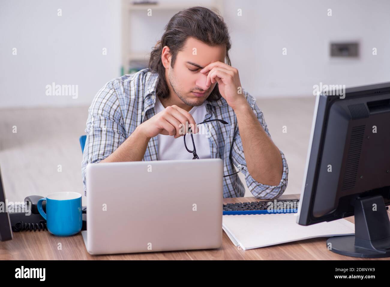 Male it specialist working in the office Stock Photo - Alamy