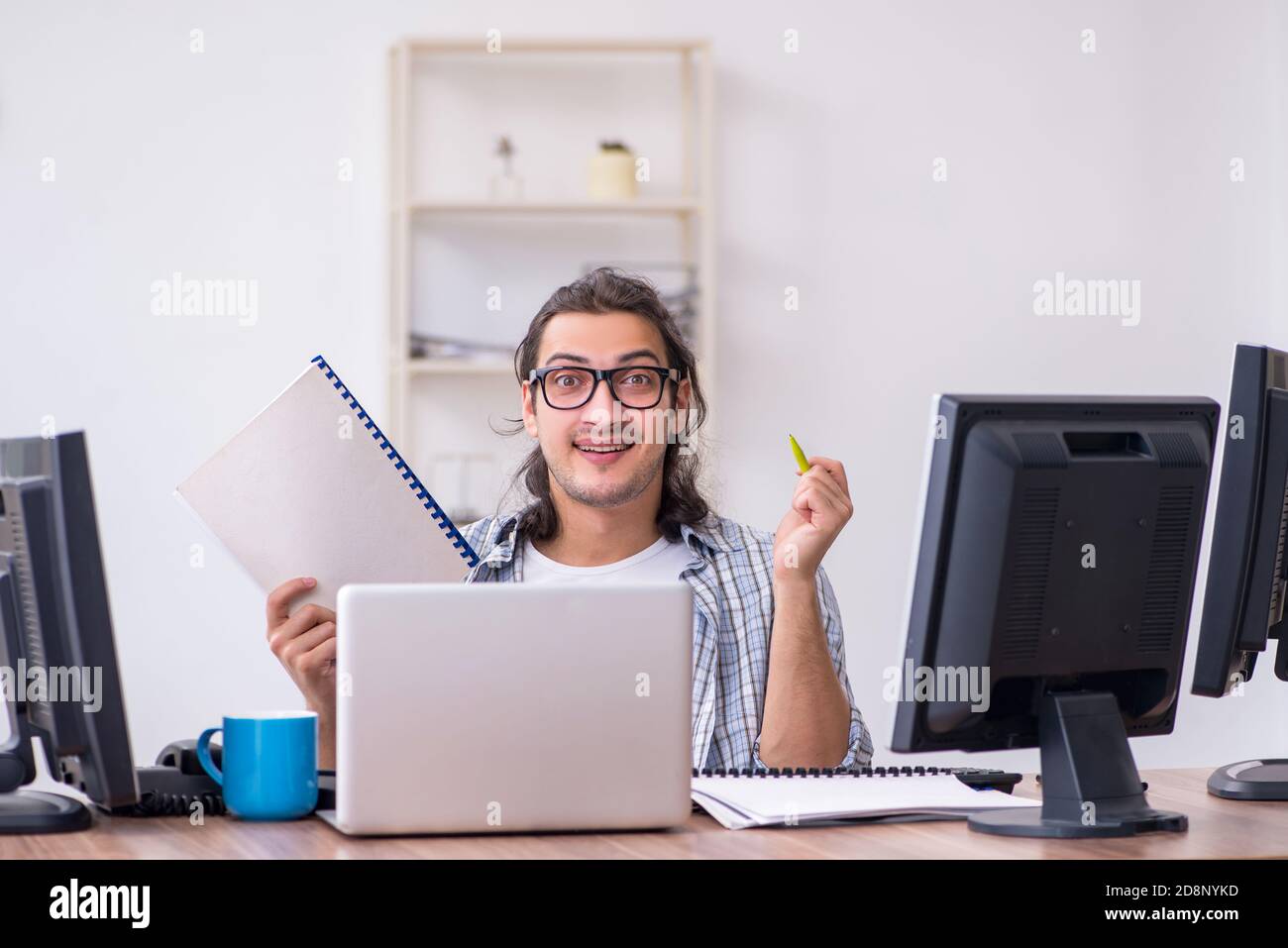 Male it specialist working in the office Stock Photo - Alamy