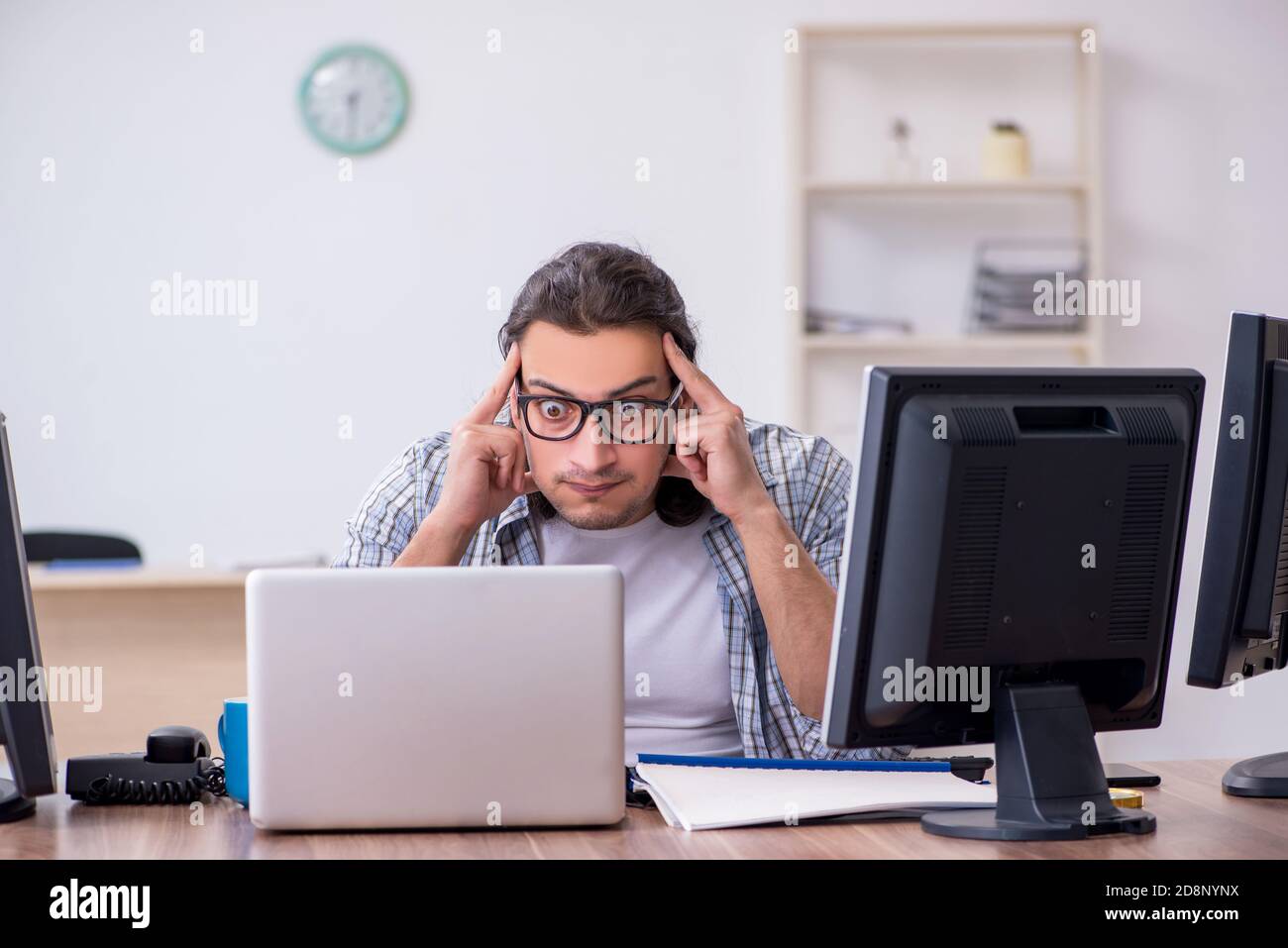Male it specialist working in the office Stock Photo - Alamy