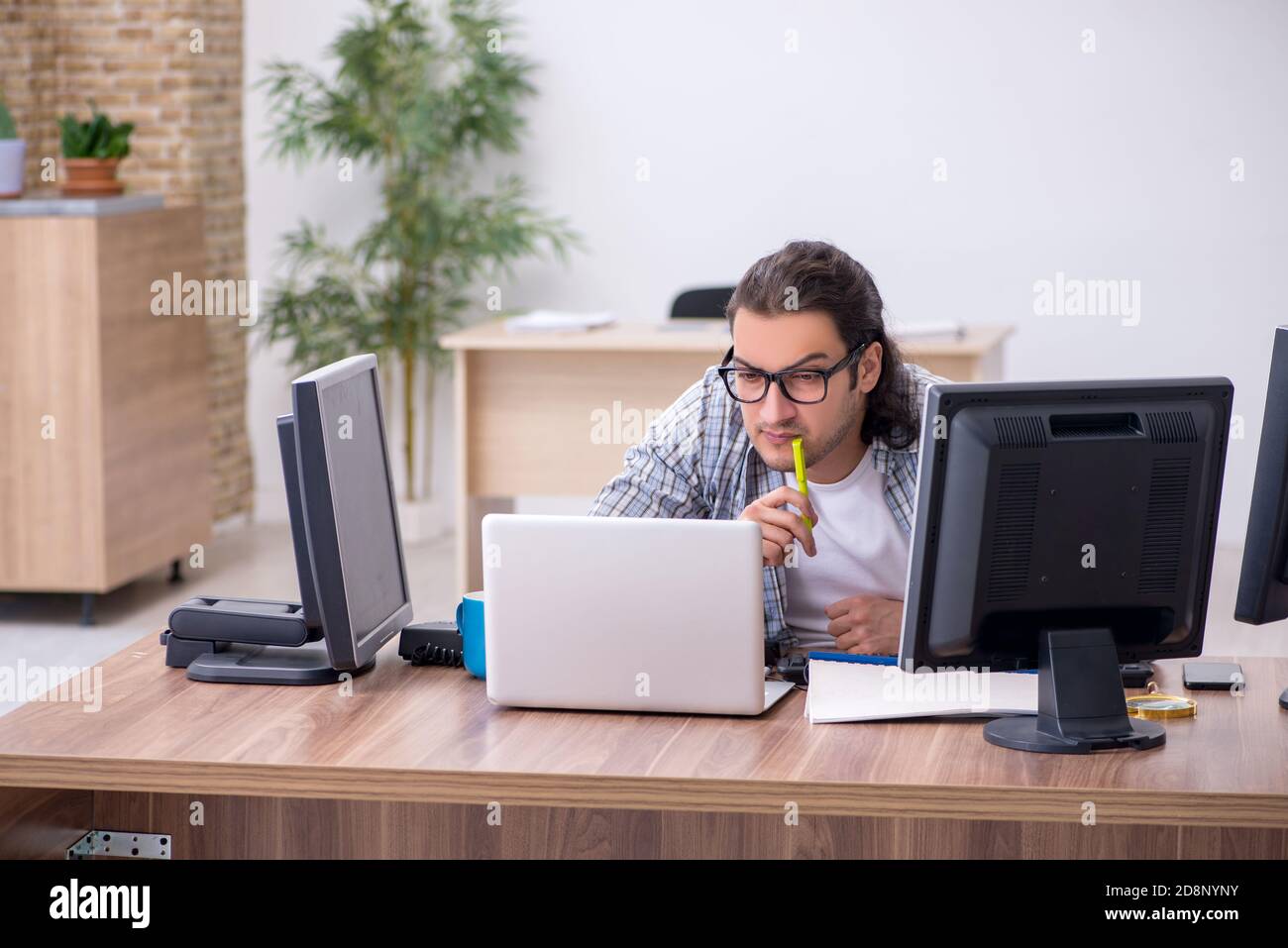 Male it specialist working in the office Stock Photo - Alamy