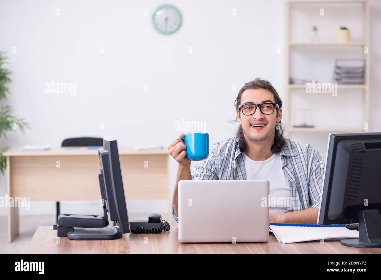 Male it specialist working in the office Stock Photo - Alamy