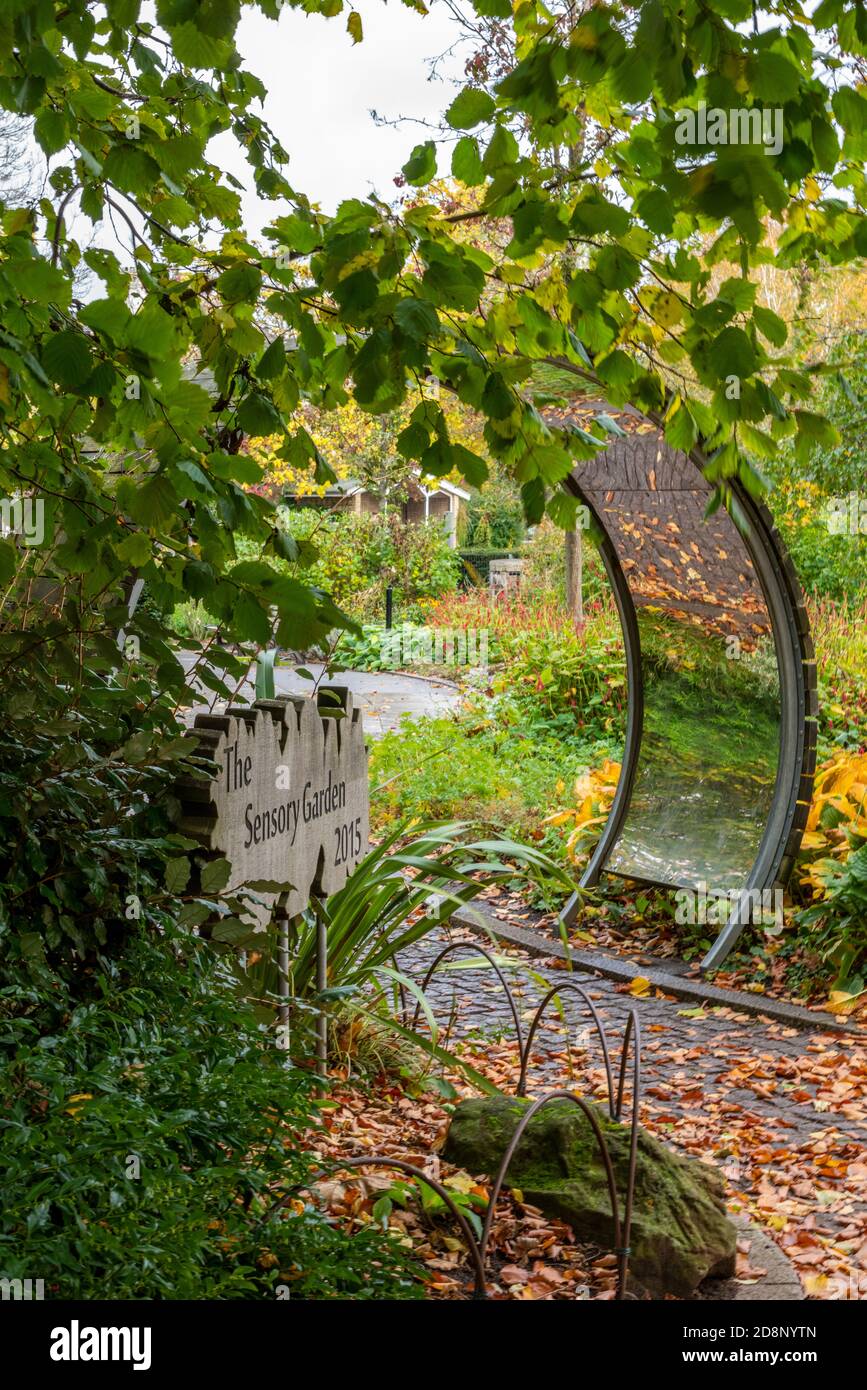 decorative glass and chrome art installation archway in a park in ...