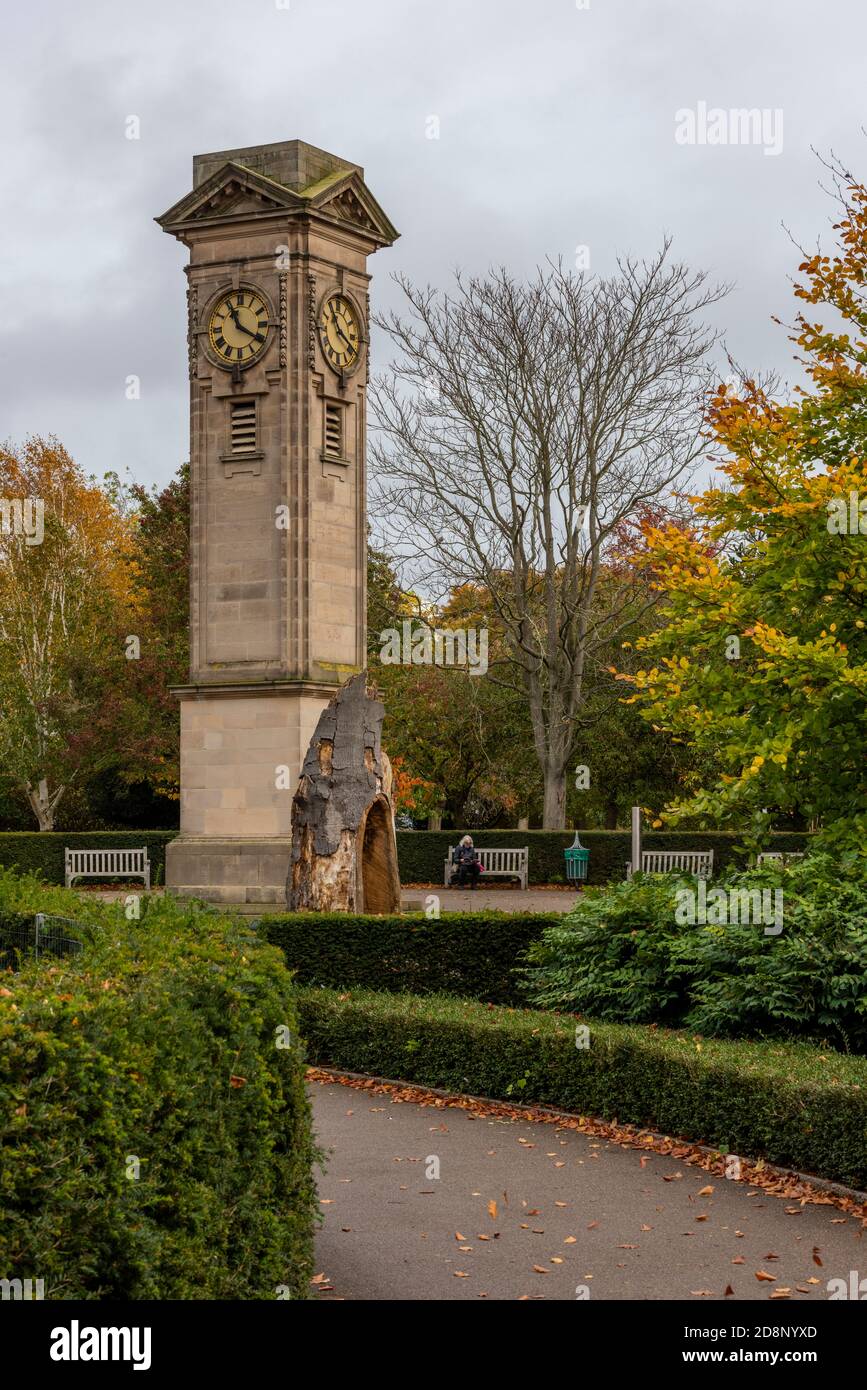 clocktower in the park at leamington spa nextto some topiary hedges ...