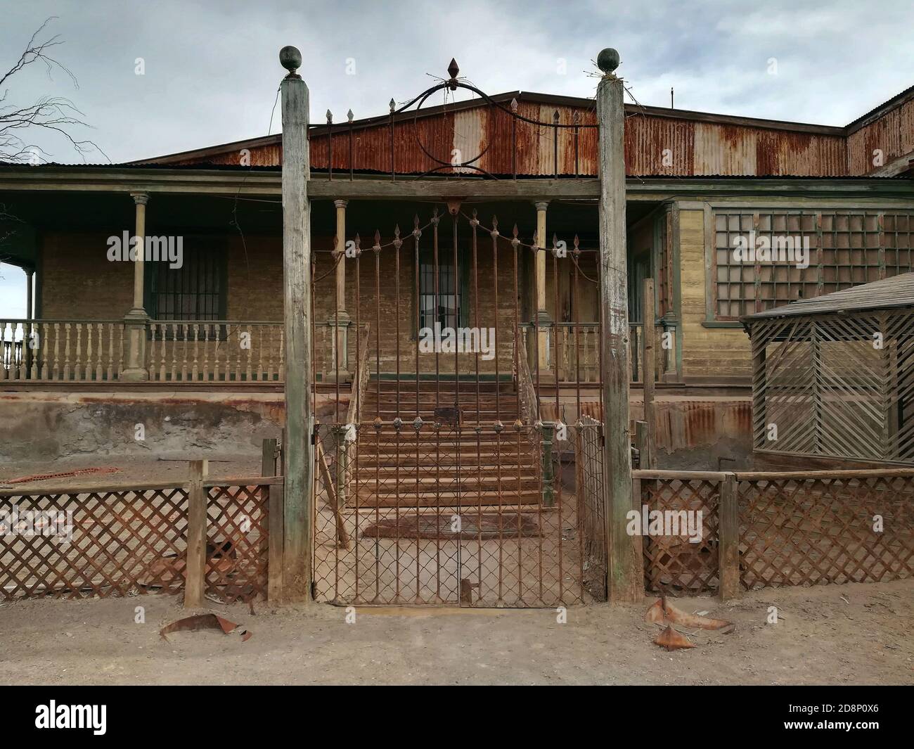 Metallic fence of the old and aged and rusty house in the countryside ...
