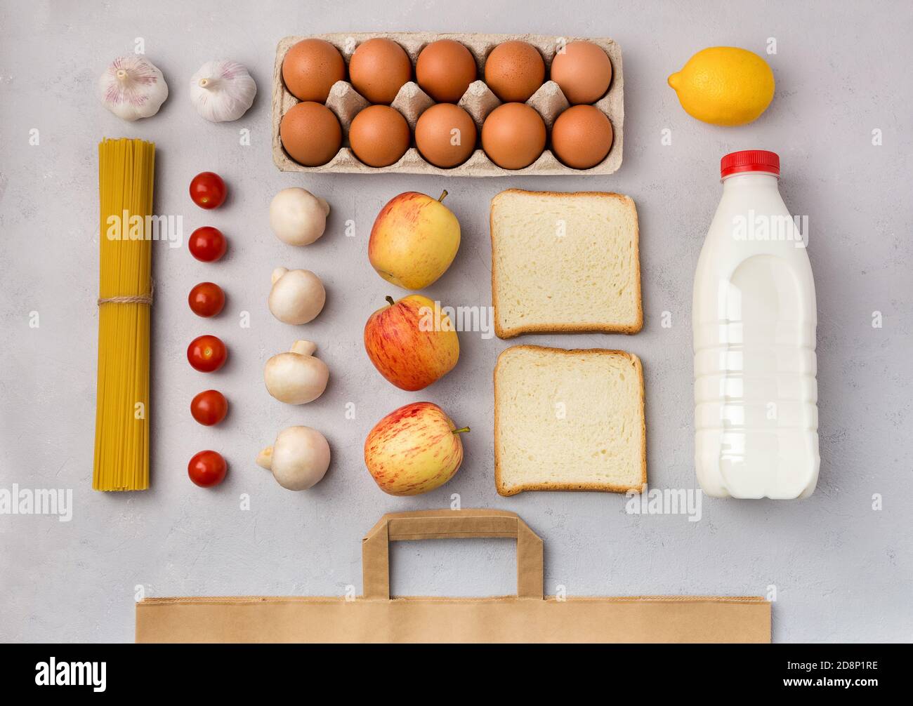 Set of grocery items flat lay on gray background. Online order of ...