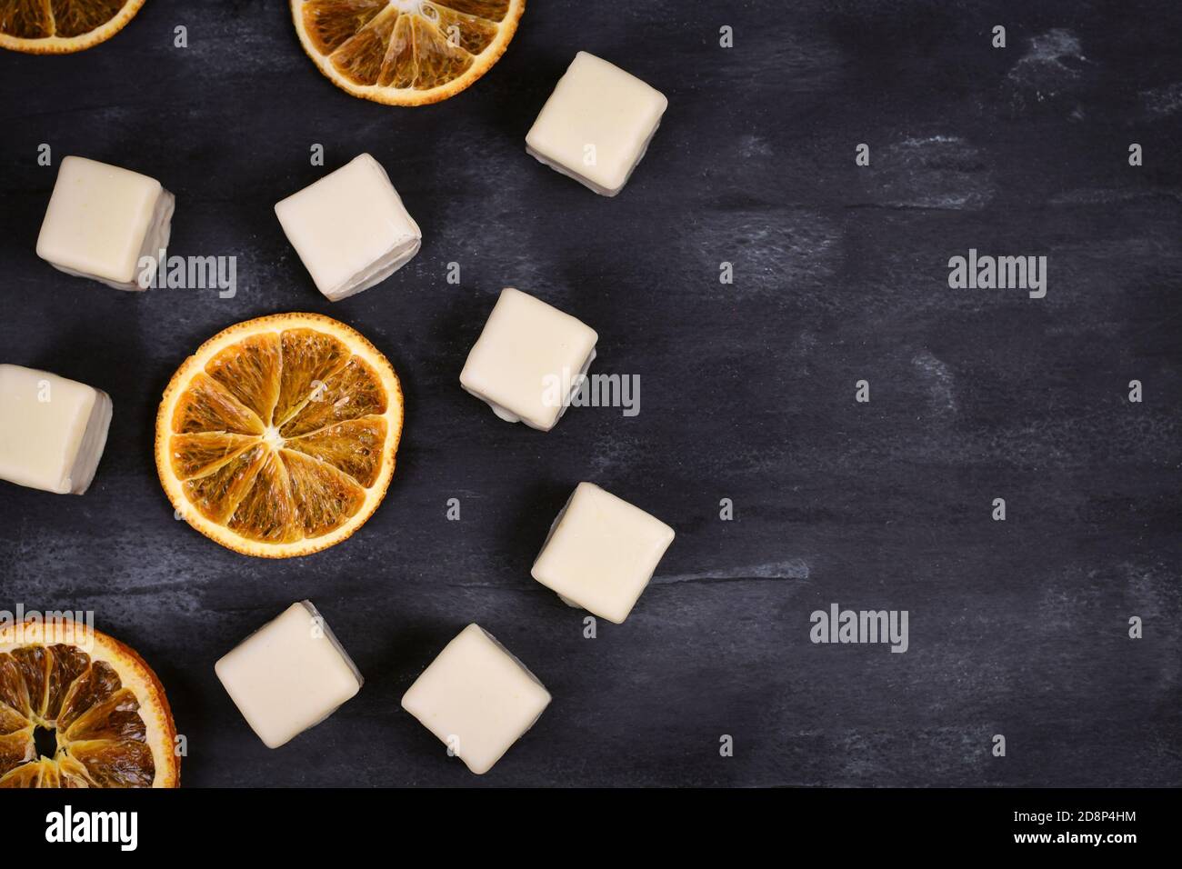 German Christmas candy called 'Dominosteine' and orange slices. A ...