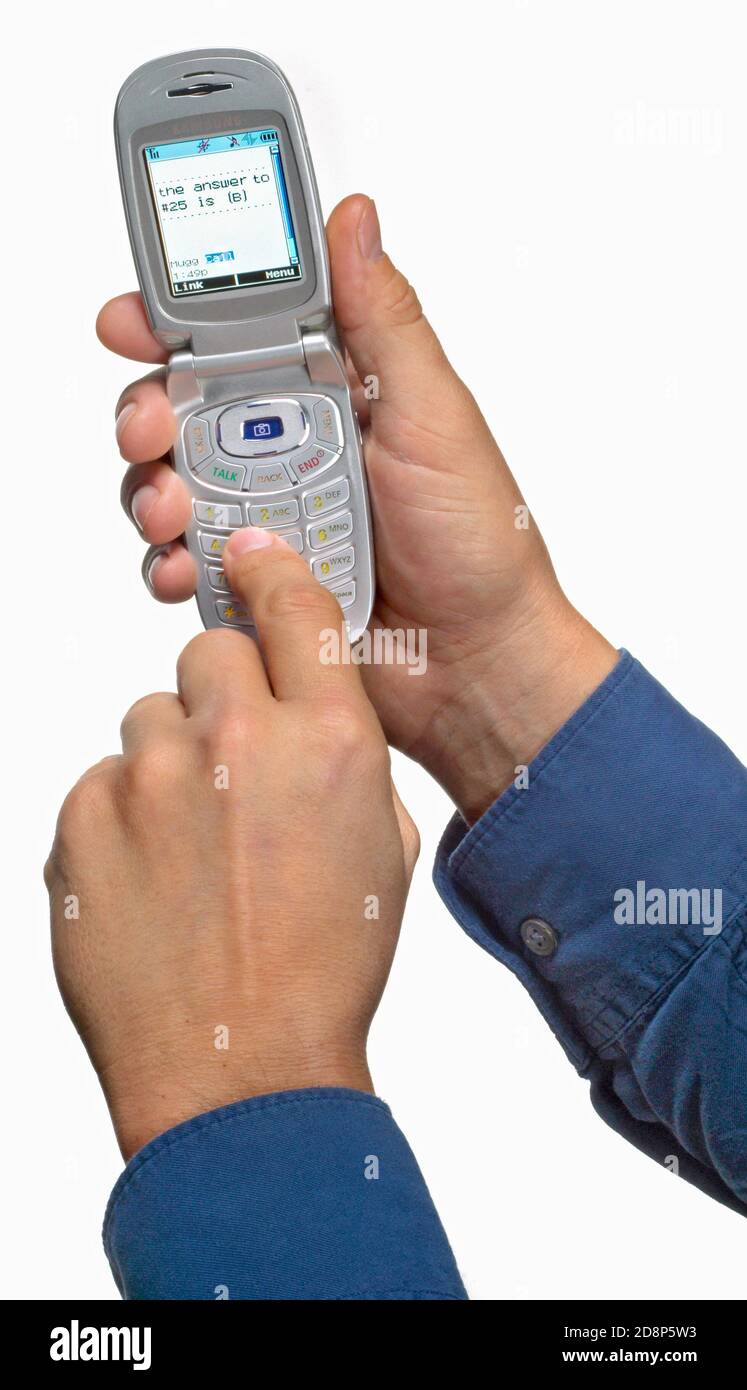 text message on a cell phone with hand model photographed on a white ...