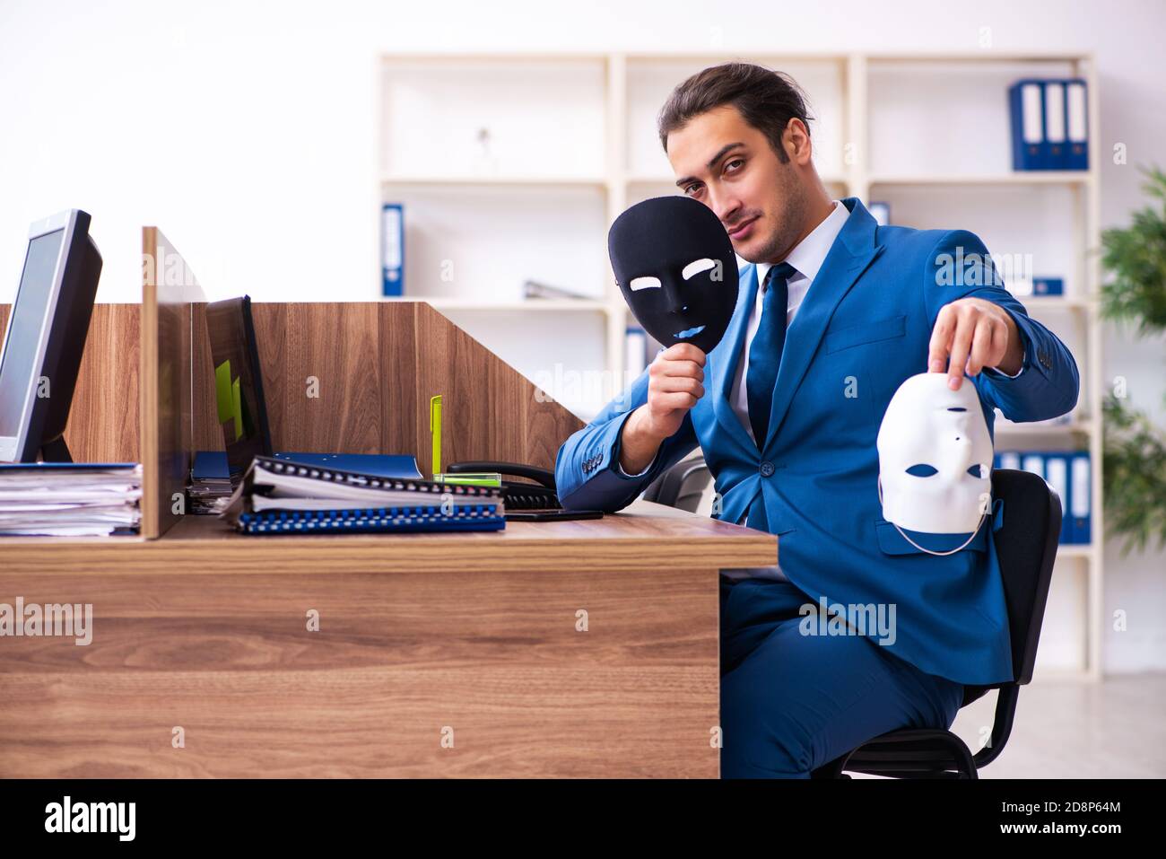 Young employee wearing mask in the office Stock Photo - Alamy