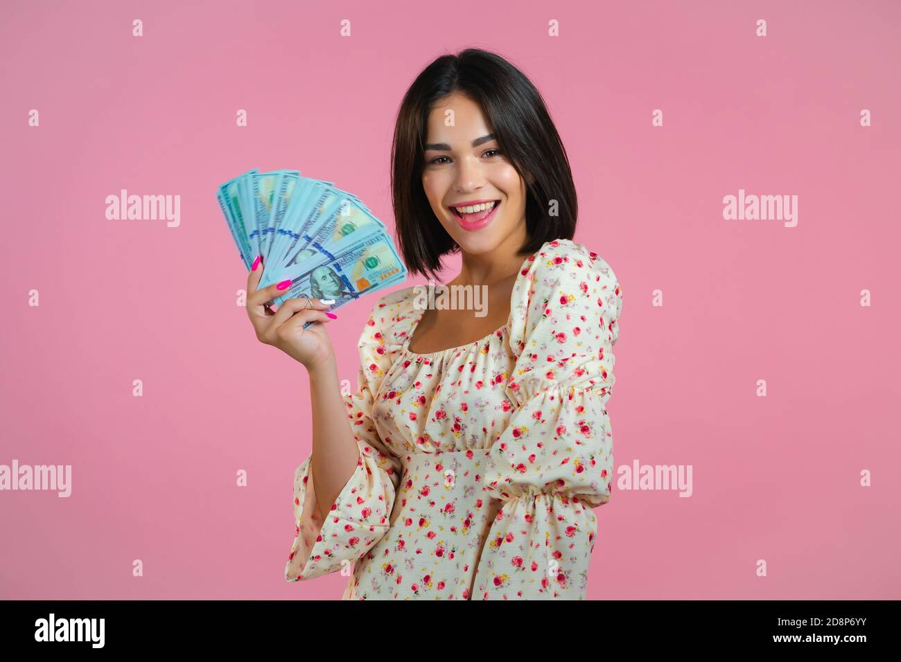Amazed happy excited woman showing money - U.S. currency dollars ...