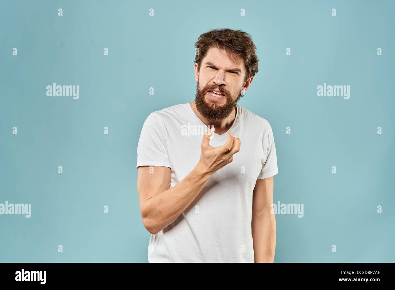 Bearded man emotions facial expression gestures hands close-up blue ...