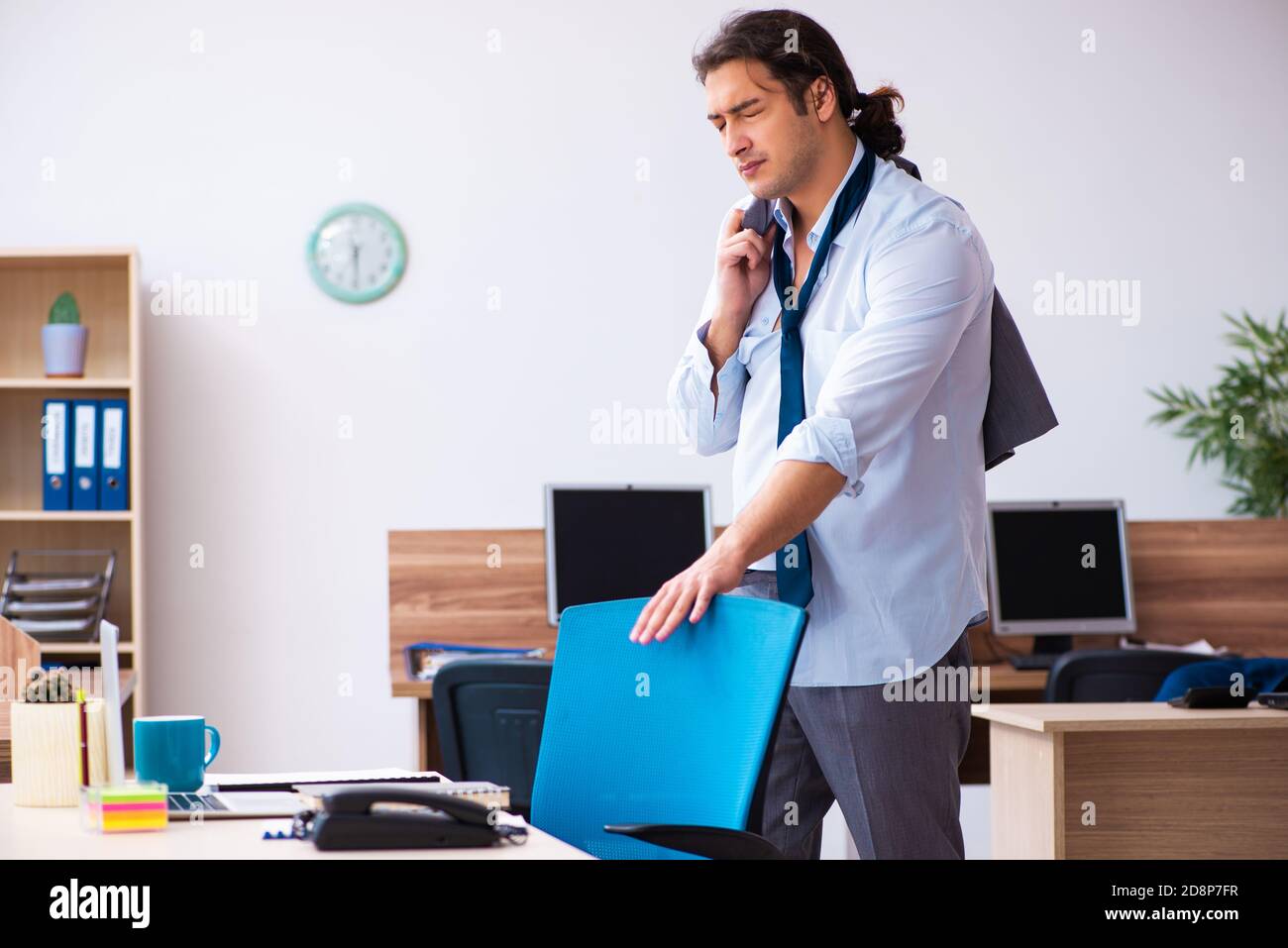 Male employee being late for his job Stock Photo - Alamy