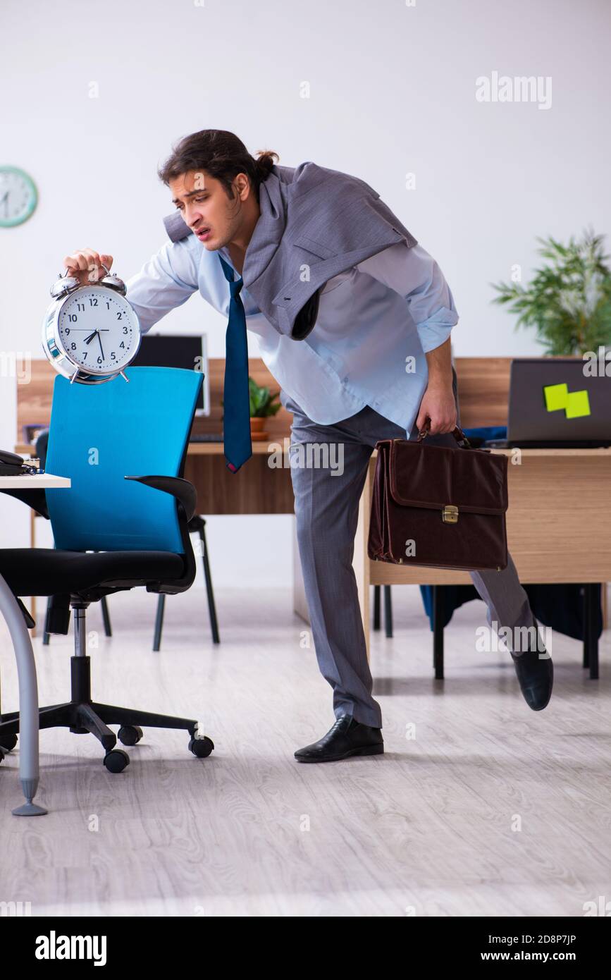 Male employee being late for his job Stock Photo - Alamy